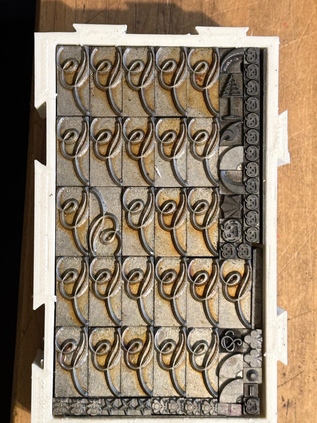 25 Scrolls Cast in Monotype Metal as 24x48 Point Ornaments. Several ...