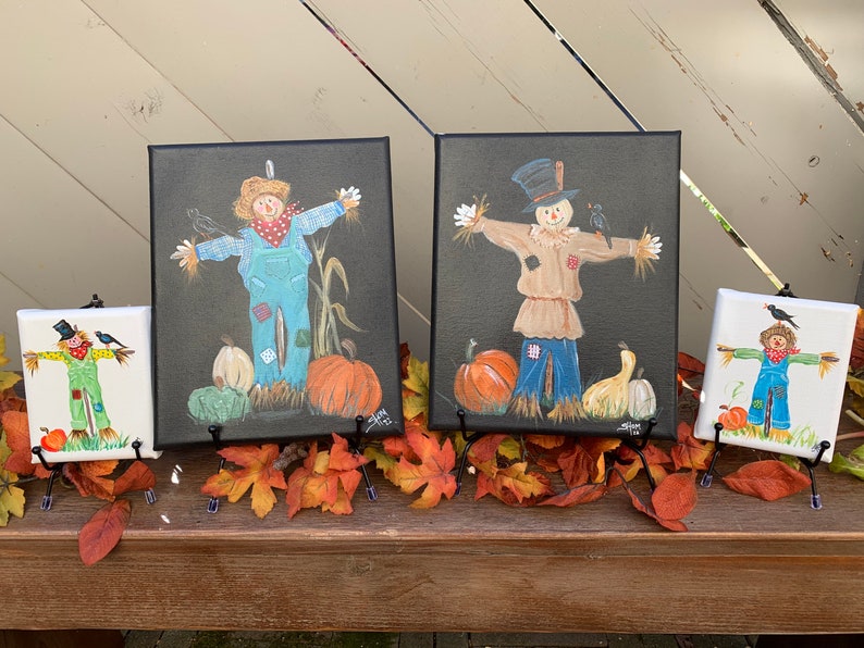 Adorable Scarecrow Standing in a Pumpkin Patch With His Friend the Crow ...