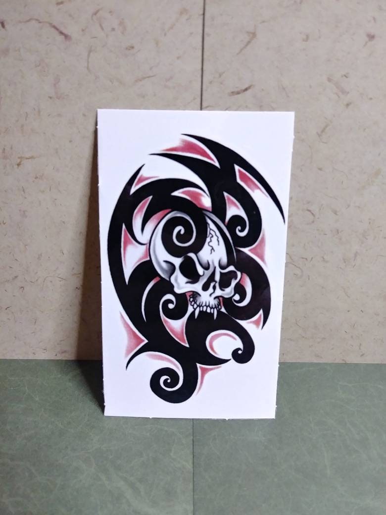 Tribal Skull Arm Tattoo