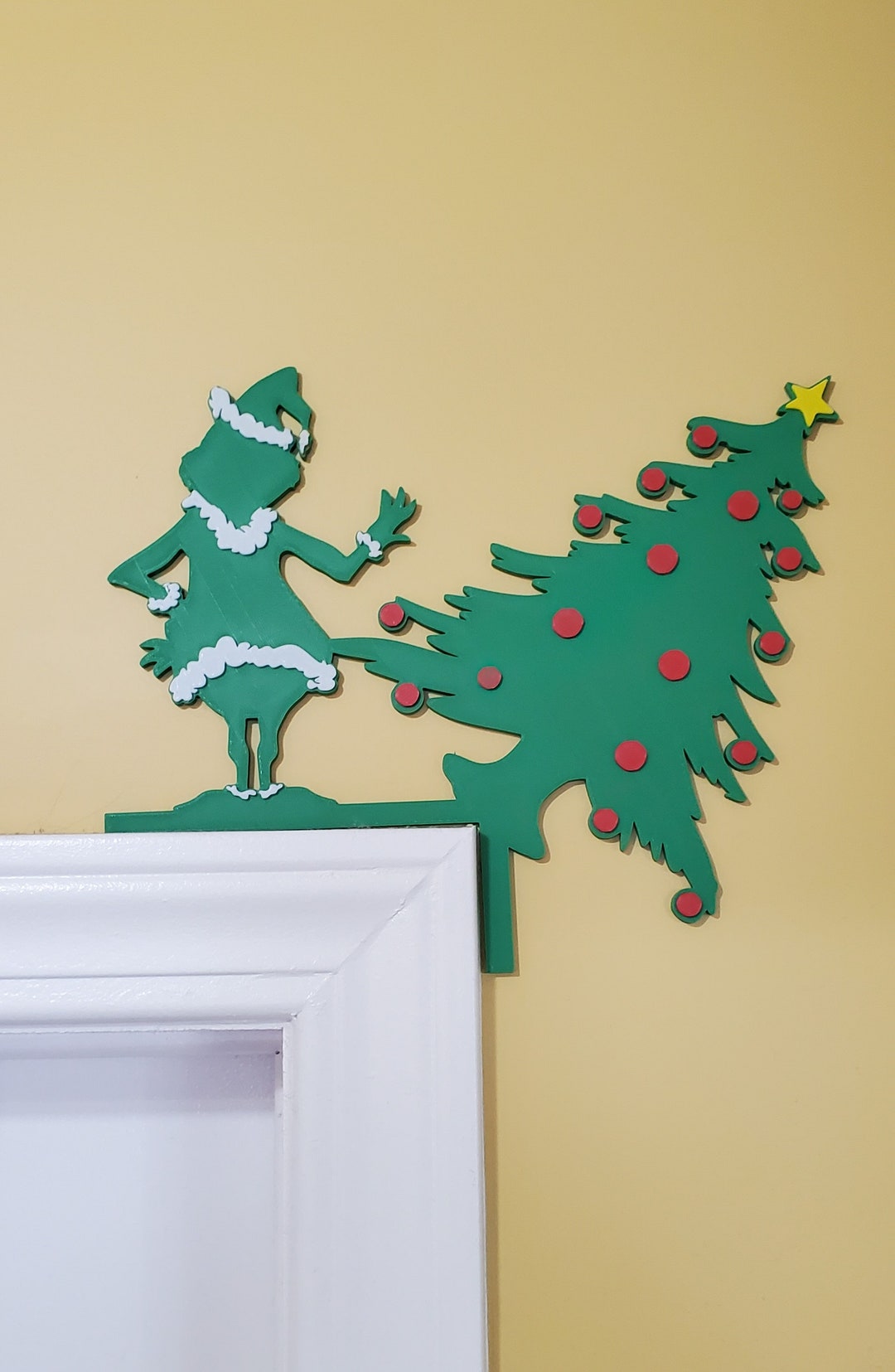 Grinch Christmas Decoration for Door Frames. Grinch Pushing a Christmas ...