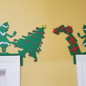 Grinch Christmas Decoration for Door Frames. Grinch Pushing Stack of ...