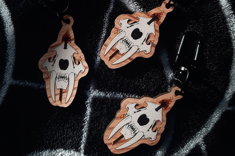Sabertooth Cat Smilodon and Spear Charm - Etsy