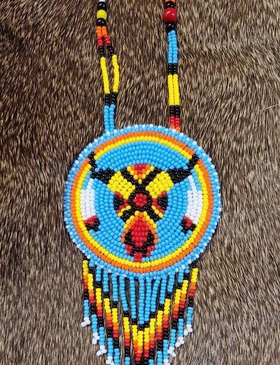 Traditional native American hand beaded rosette medallion - munimoro.gob.pe