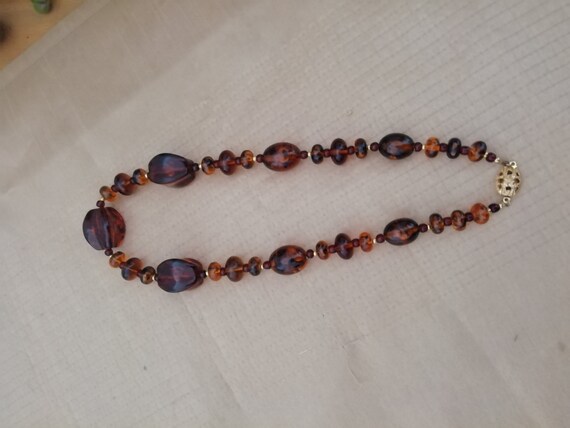 Dark amber coloured necklace - Gem