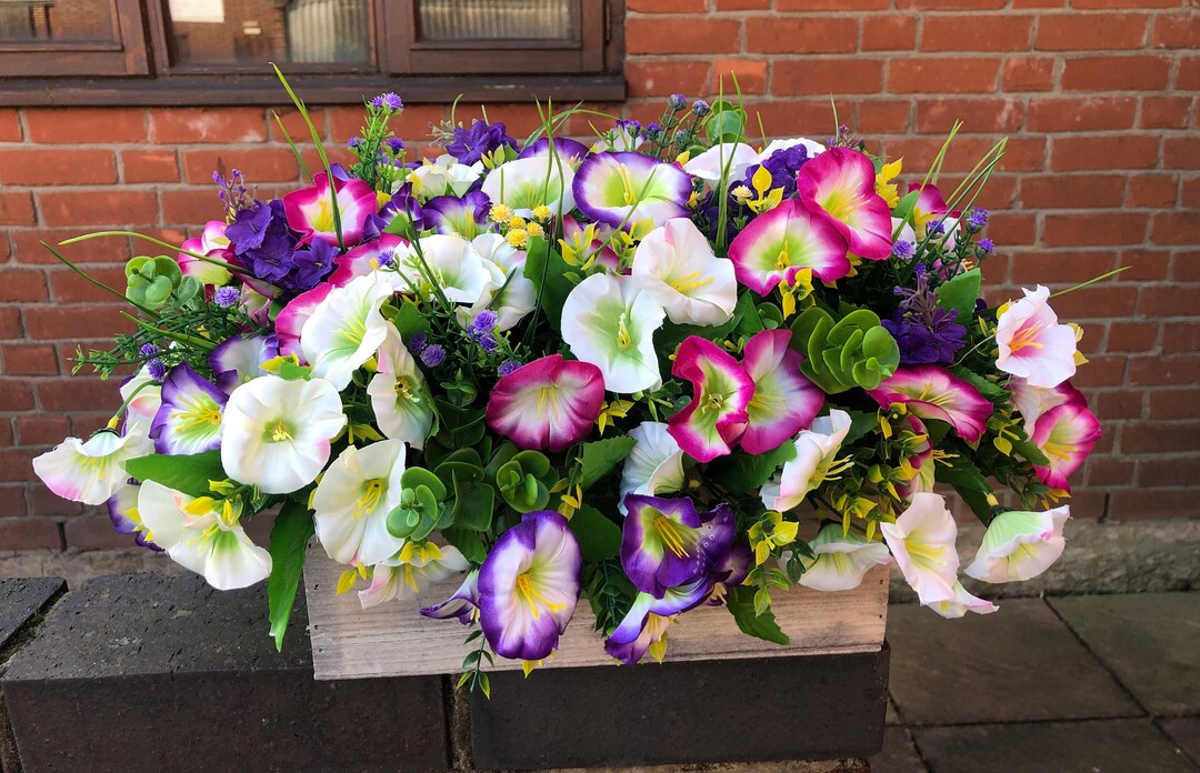 Window Box Filled With Artificial Flowers of Morning Glory Petunias and ...