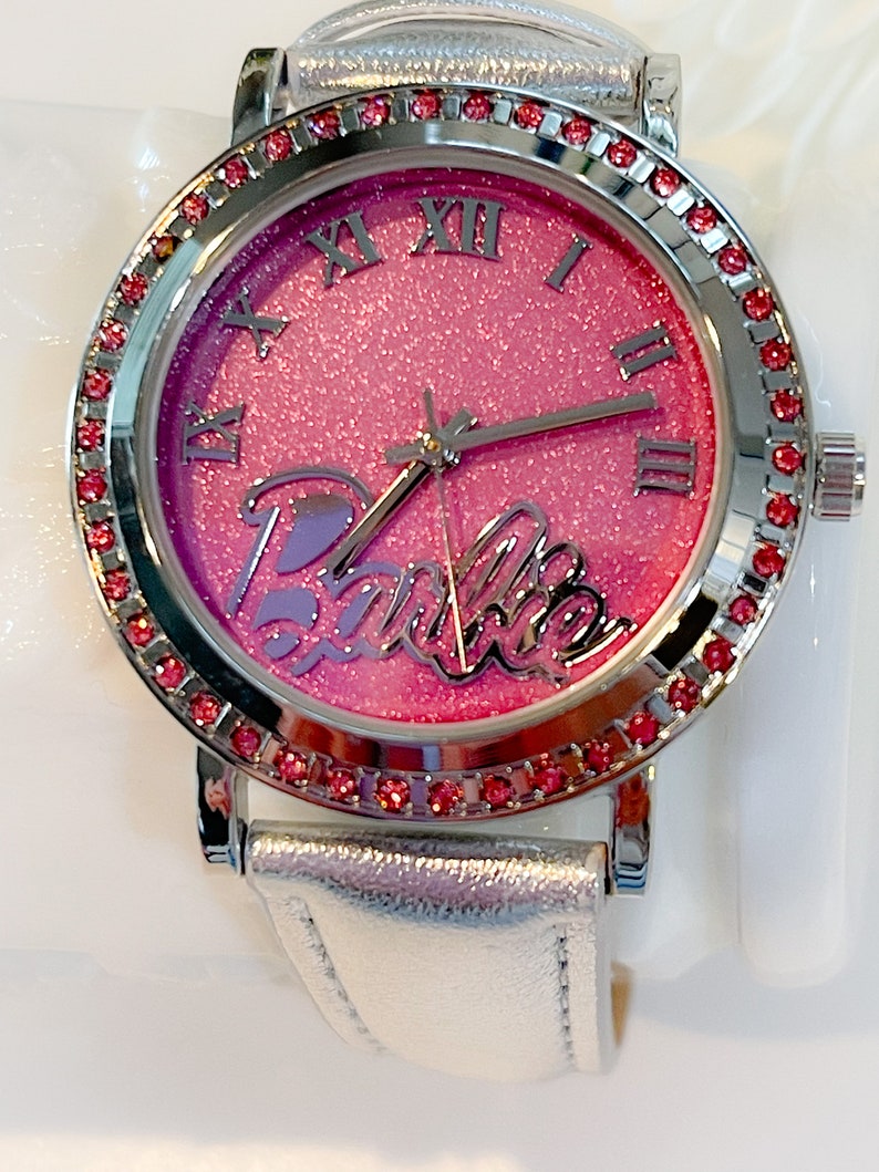 Barbie Logo Quartz Mattel Pink Rhinestones Metallic Silver Band Watch ...
