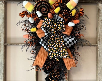 Halloween Ghosts and Sweets Swag With Candy Corn, Lollipops and Cake ...