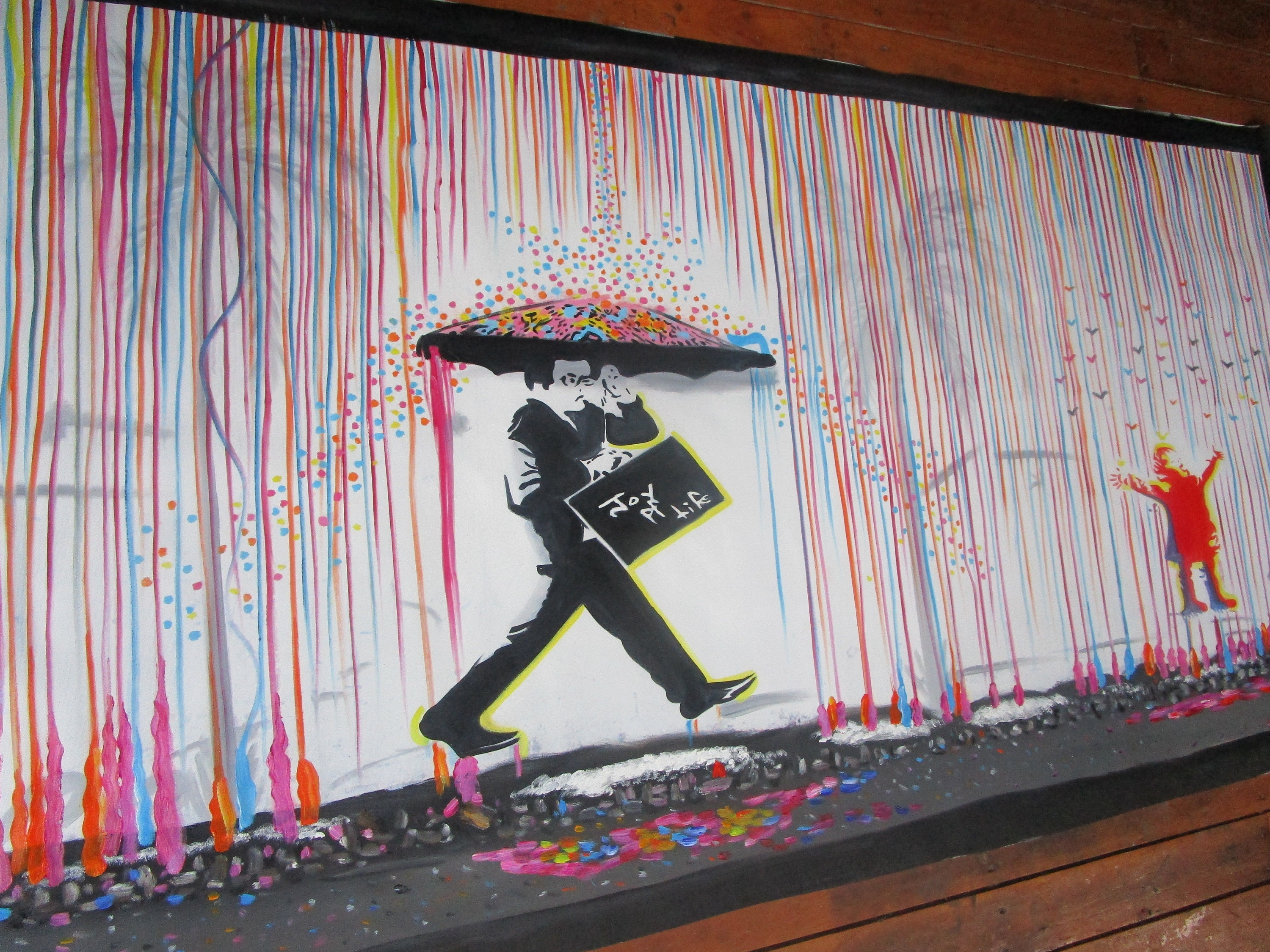 Rainbow Painting Of Man Logo