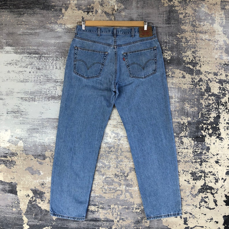 W36 Vintage Levi's 550 Faded Stone Wash Jeans 90s Womens High Waisted Pants Baggy Levis Light ...