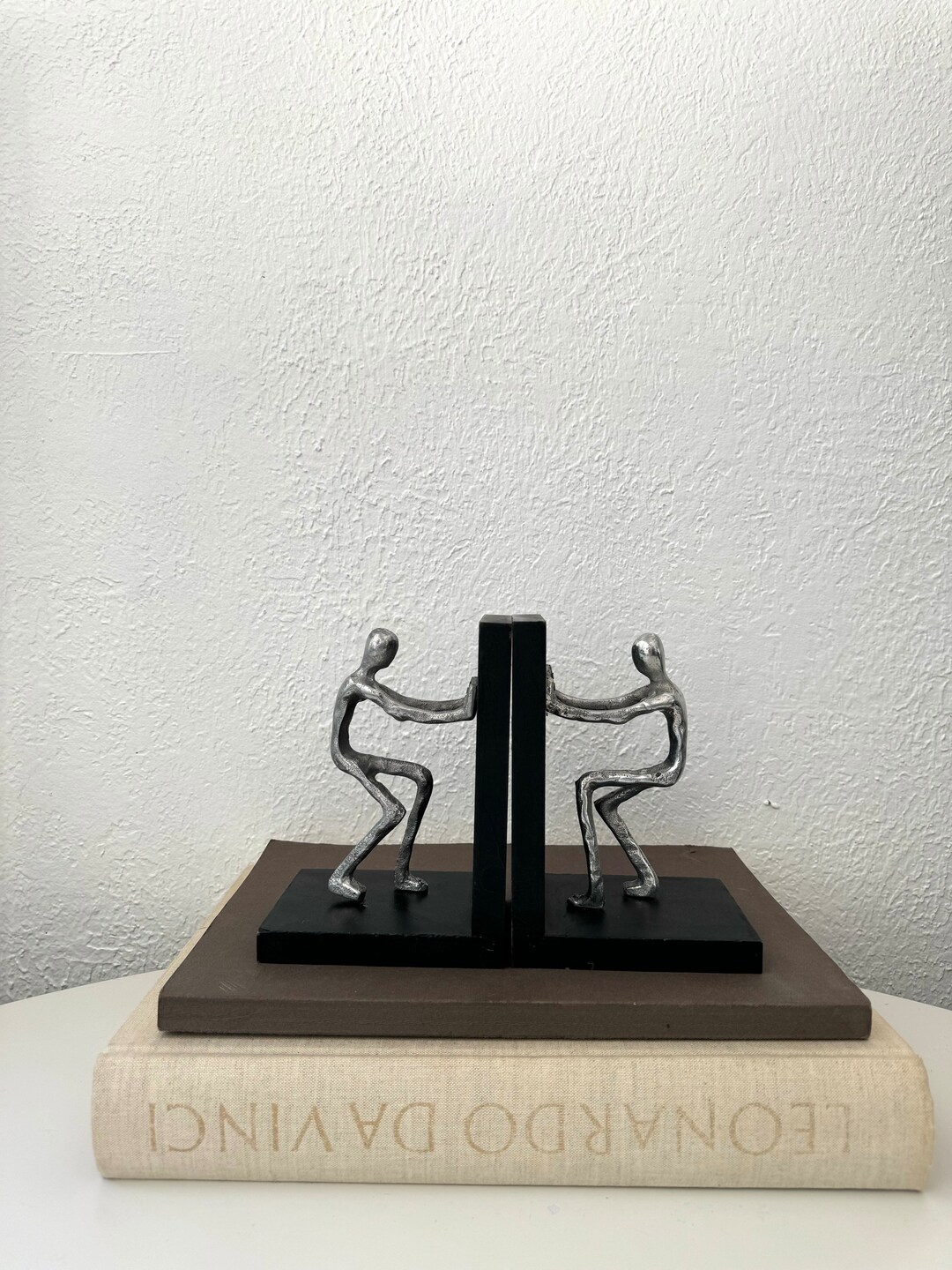 Silver Metal Men Pushing Sculpture Bookends | Set of 2 - Etsy