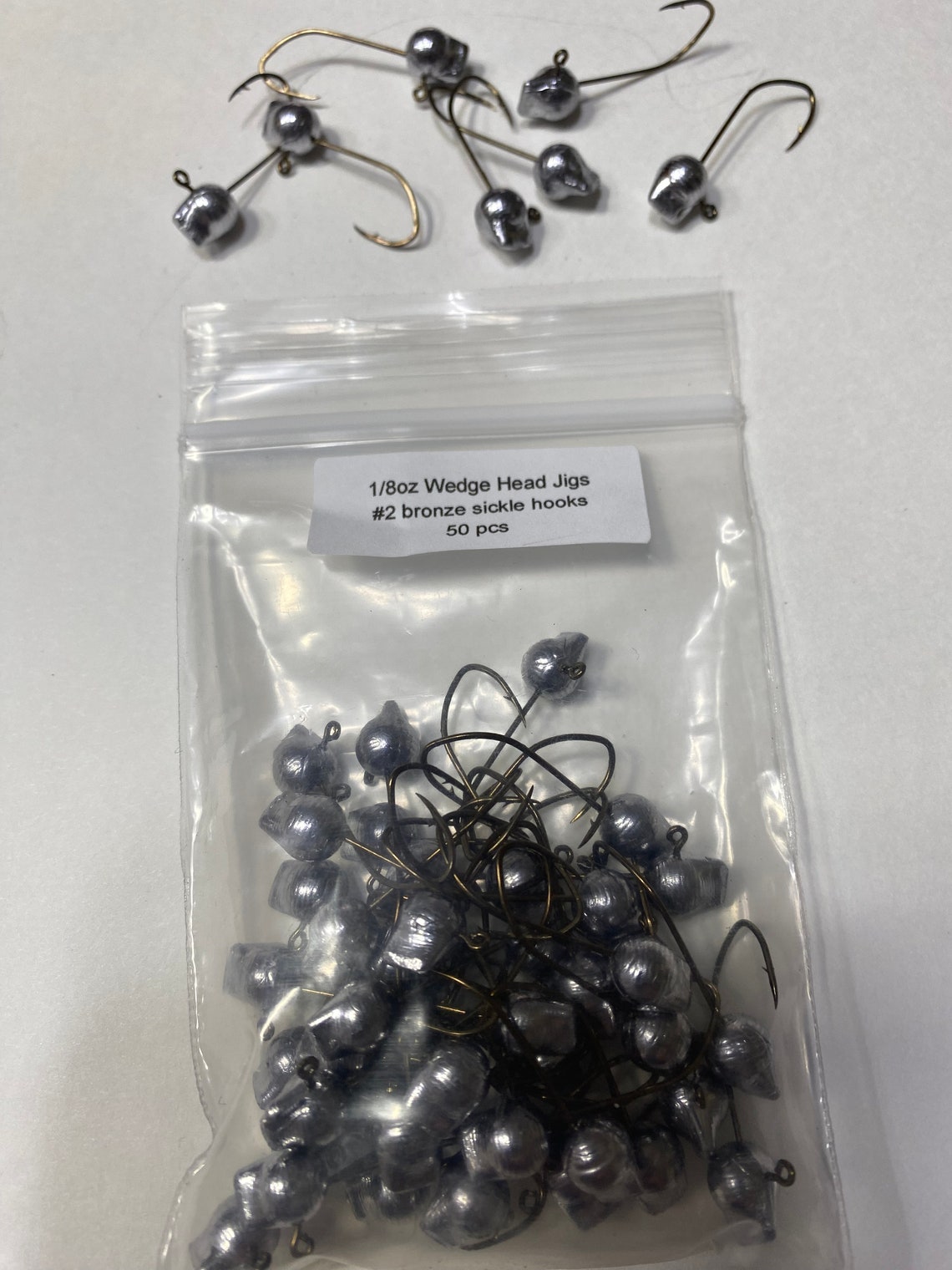 50 Unpainted Wedge Head Jigs With No Collar and Bonze Sickle Hooks ...