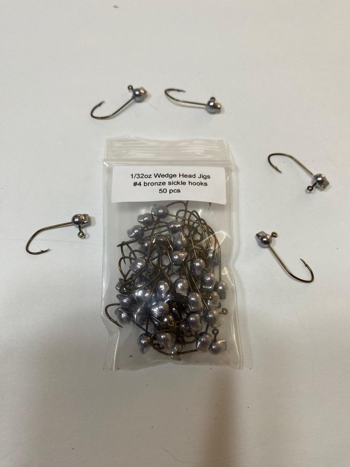 50 Unpainted Wedge Head Jigs With No Collar and Bonze Sickle Hooks ...