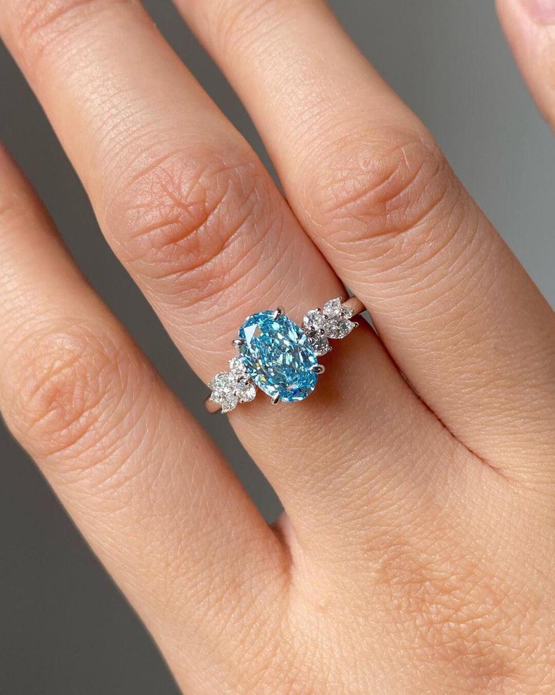 Elegant Oval-cut Blue Diamond Ring With Brilliant Side Stones Vintage ...