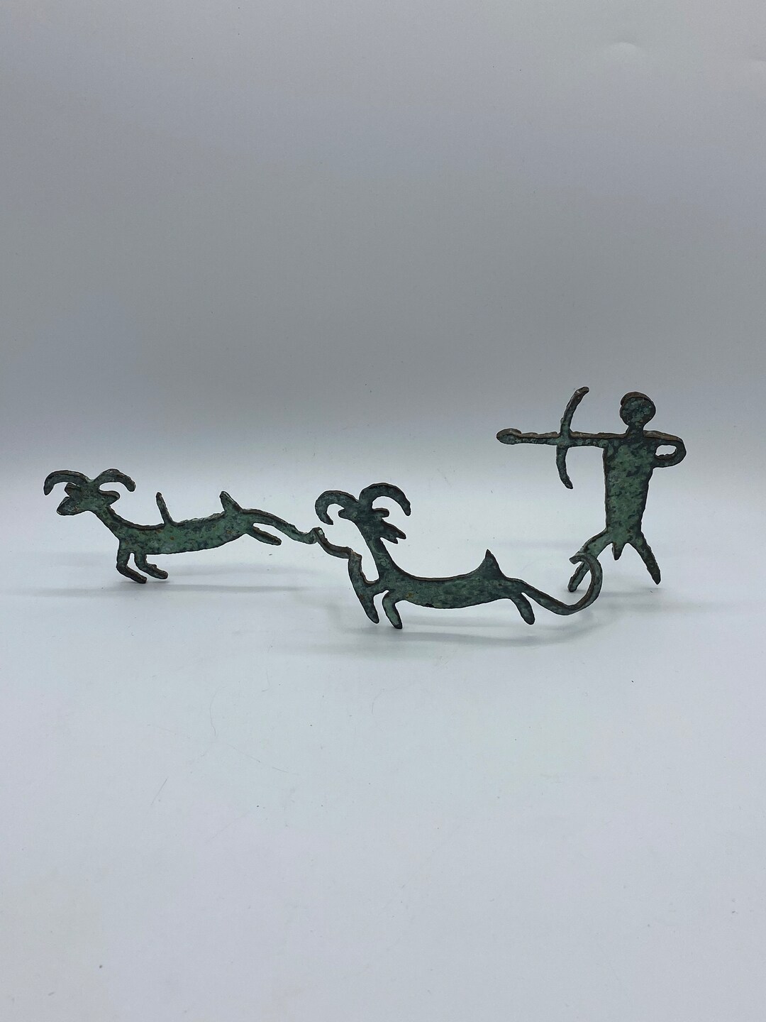 Primitive Metal Artisan Warrior With Bow Hunting Mountain Goats Wall ...