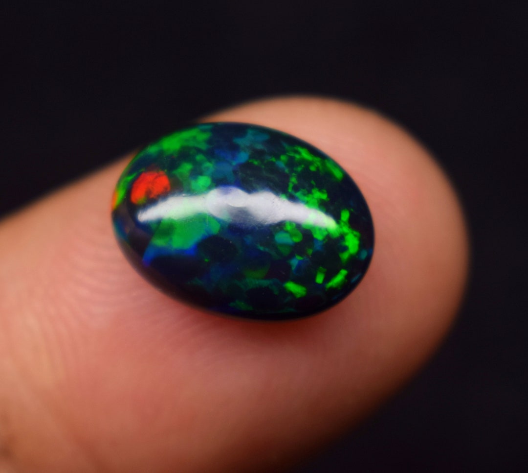 Natural Ethiopian Galaxy Fire Opal Gemstone, 2.50 Carat Black Smoked Opal Oval Shape Cabochon ...