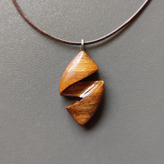 Ornately Carved Wooden Pendant