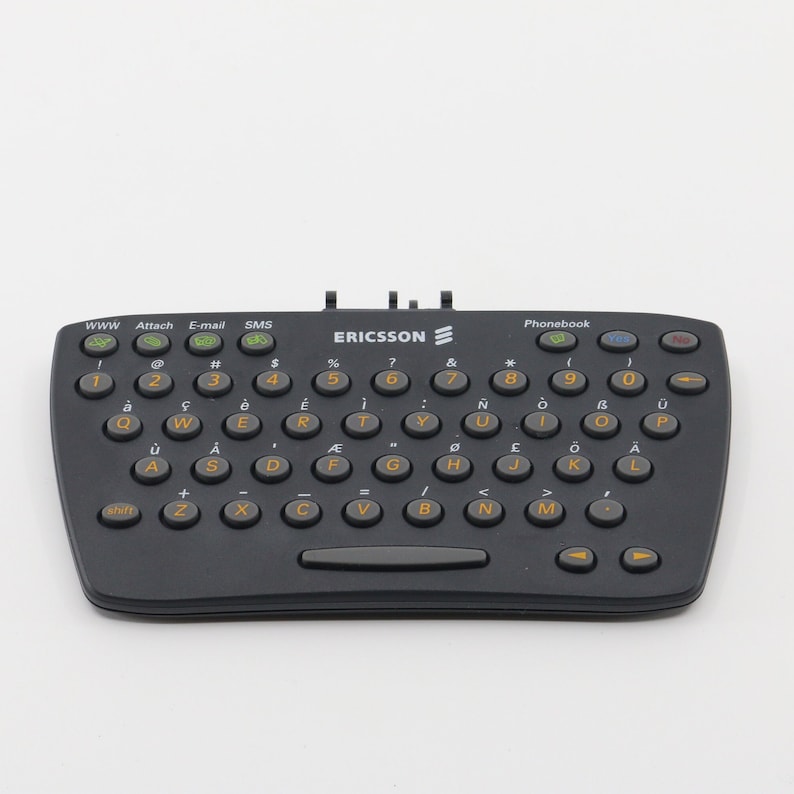 Teclado de teléfono móvil Ericsson vintage sin usar con estuche y ...