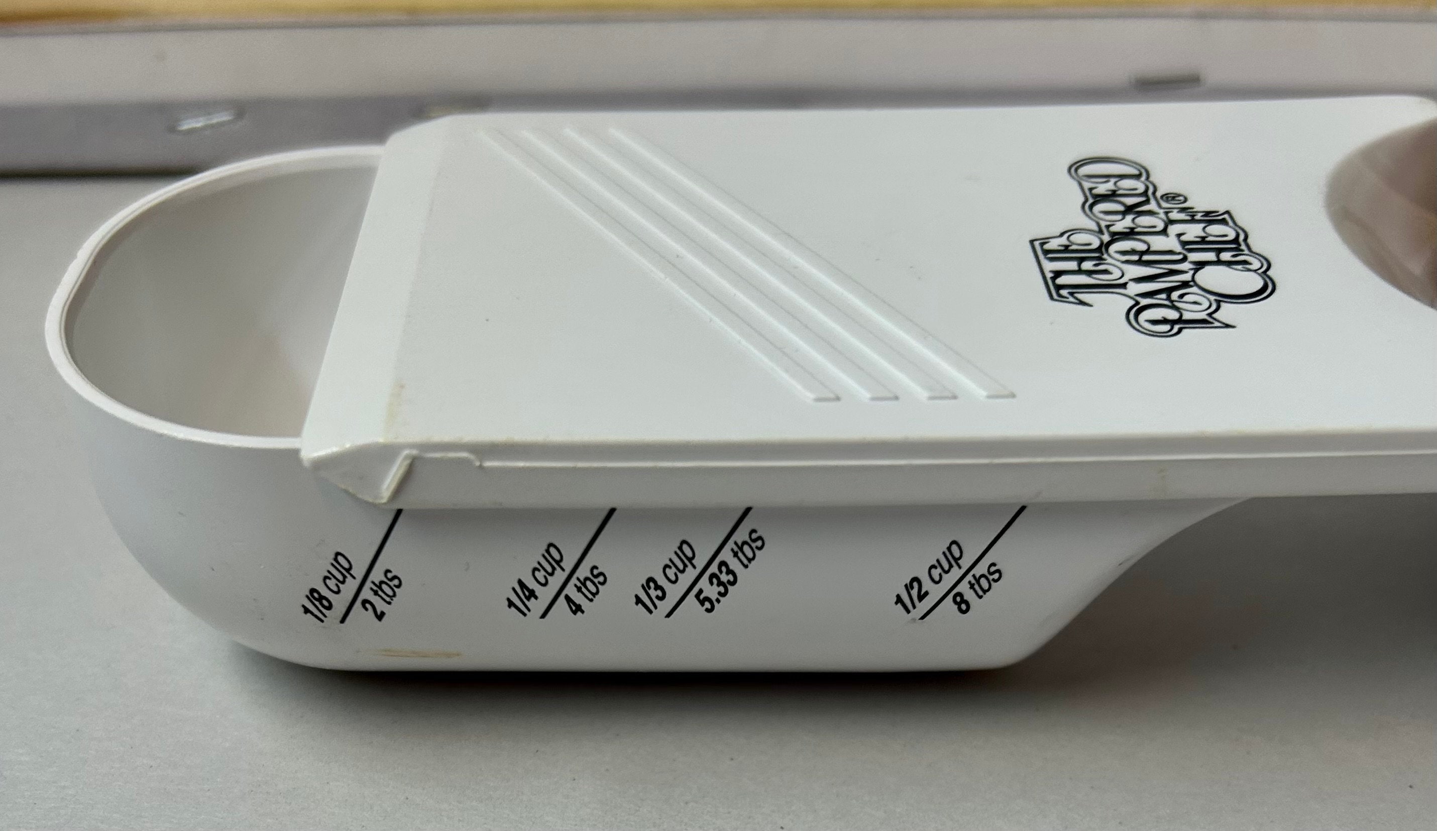 The Pampered Chef Adjustable Measuring Cup 1/8 1/2 Cup 50-250ml Dry ...