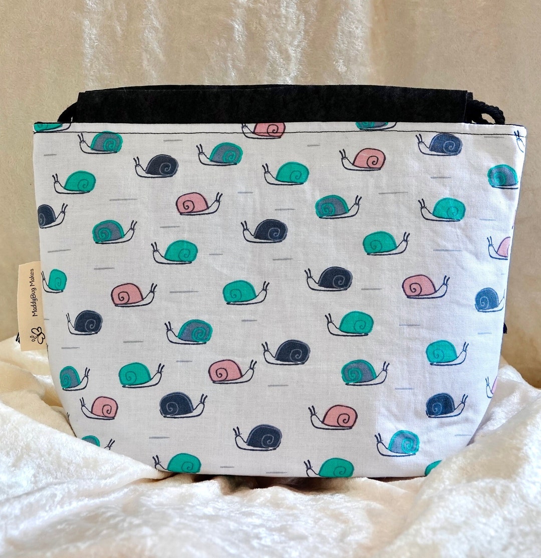 Drawstring Bag With Snails on a White Outer Fabric, a Black Distressed Lining, and a Flat Bottom ...