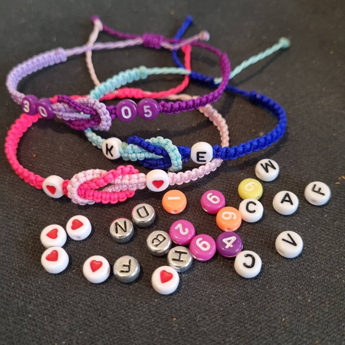 Colourful Macrame Infinity Bracelets With Letters, Hearts or Numbers ...