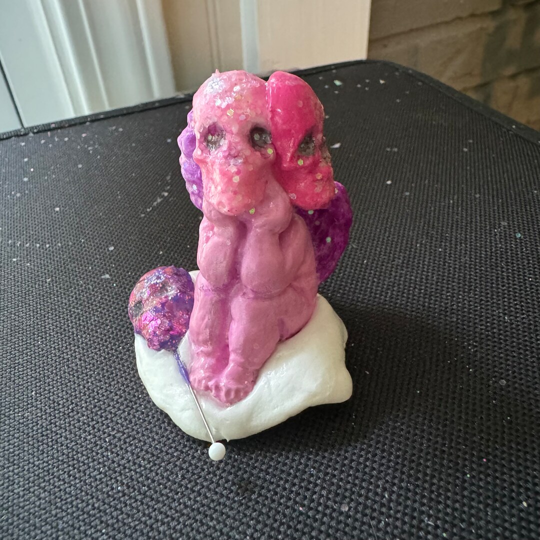 Pink and Purple Angel Cherub With Multiple Skull Masks. Shiny, Sparkly ...