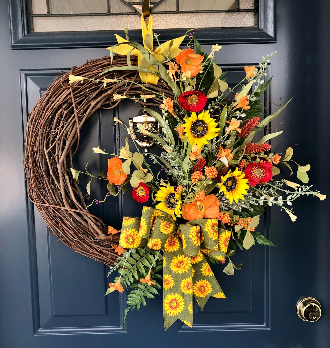Sunflower and Poppy Flowers With Assorted Greenery and Ferns With ...