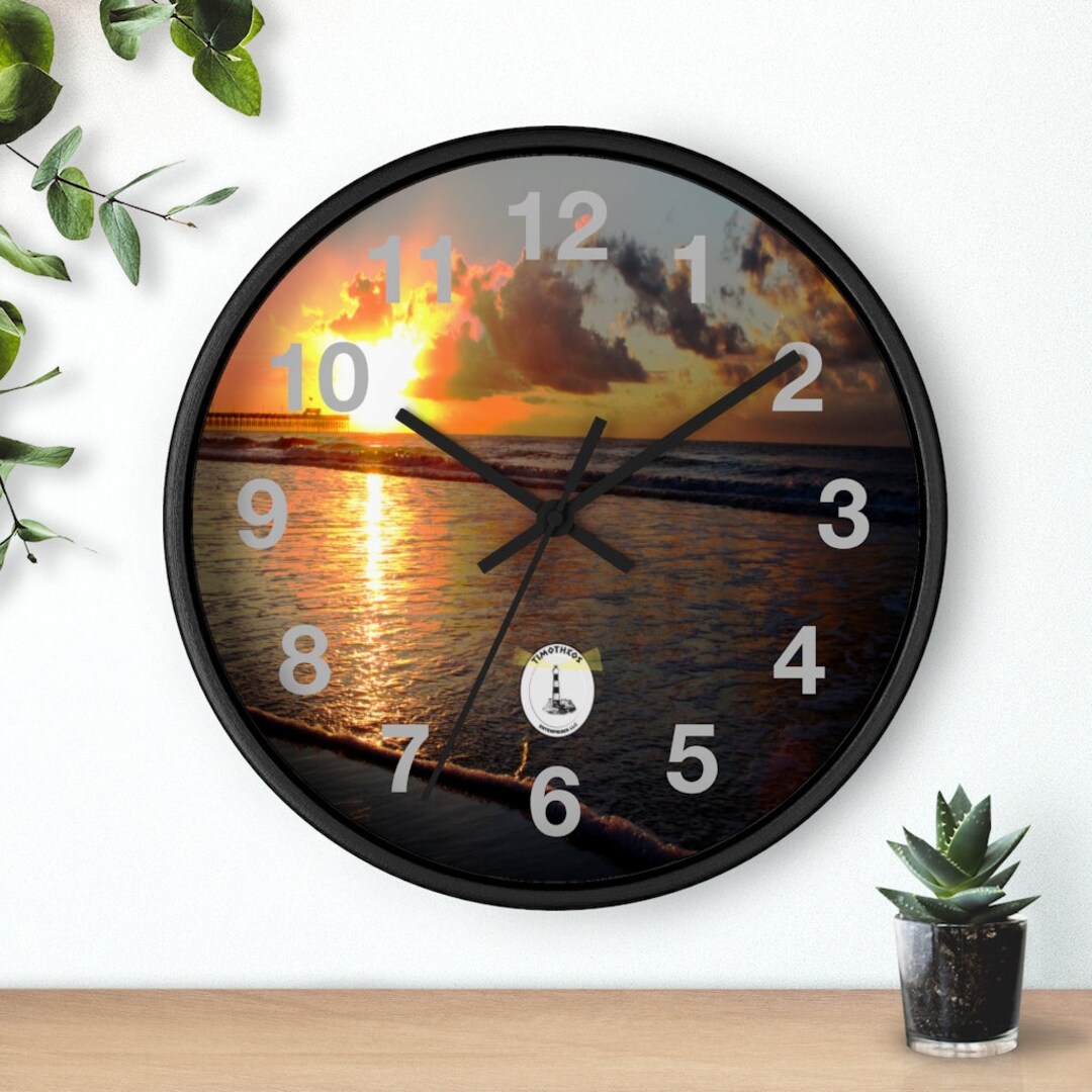 A Beautiful Wall Clock With Blabk Trim & Numbers Featuring a Blazing ...