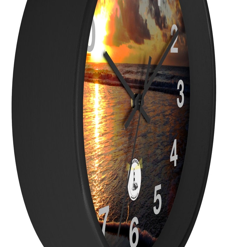 A Beautiful Wall Clock With Blabk Trim & Numbers Featuring a Blazing ...