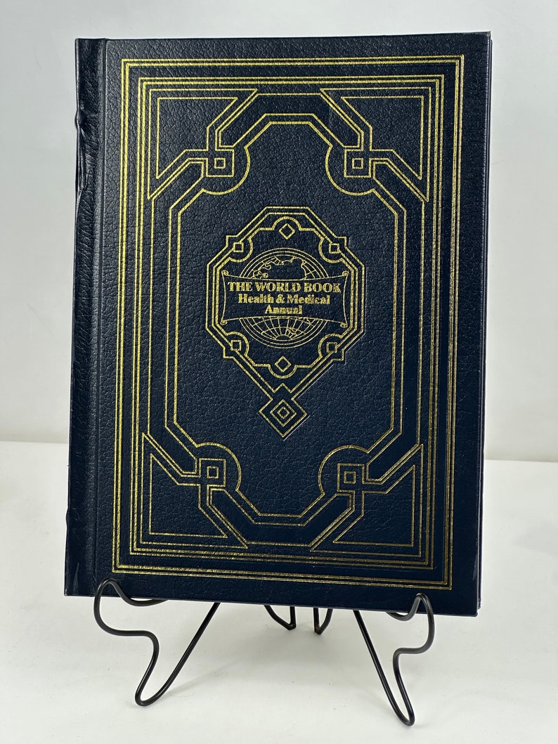 1994 the World Book Health and Medical Annual Embossed Blue & Gilt ...