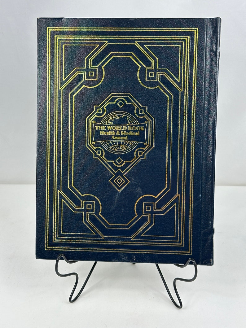 1994 the World Book Health and Medical Annual Embossed Blue & Gilt ...