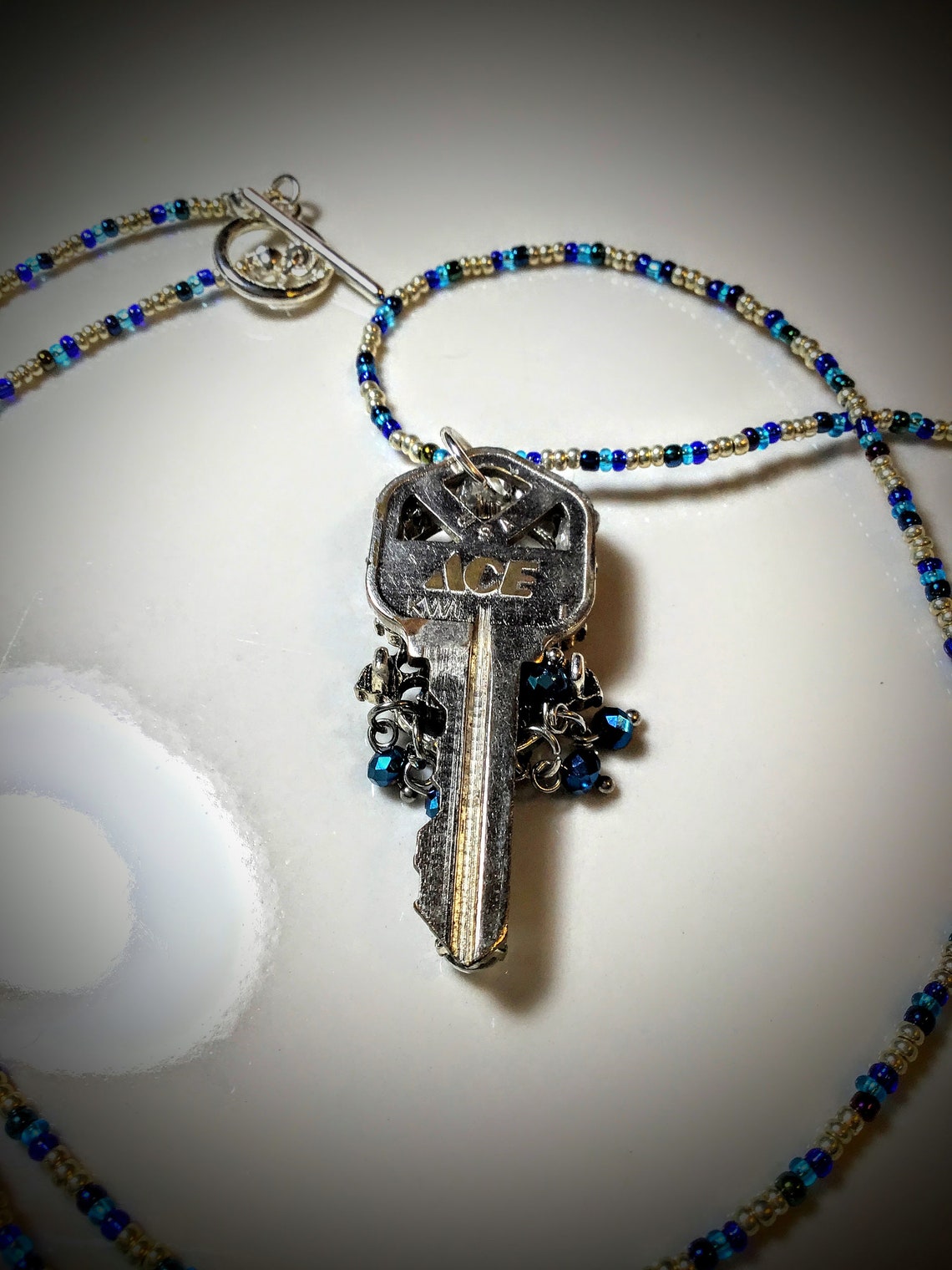 Electric Blue Key Pendant on 30 Inch Beaded Necklace in Silver and Blue ...
