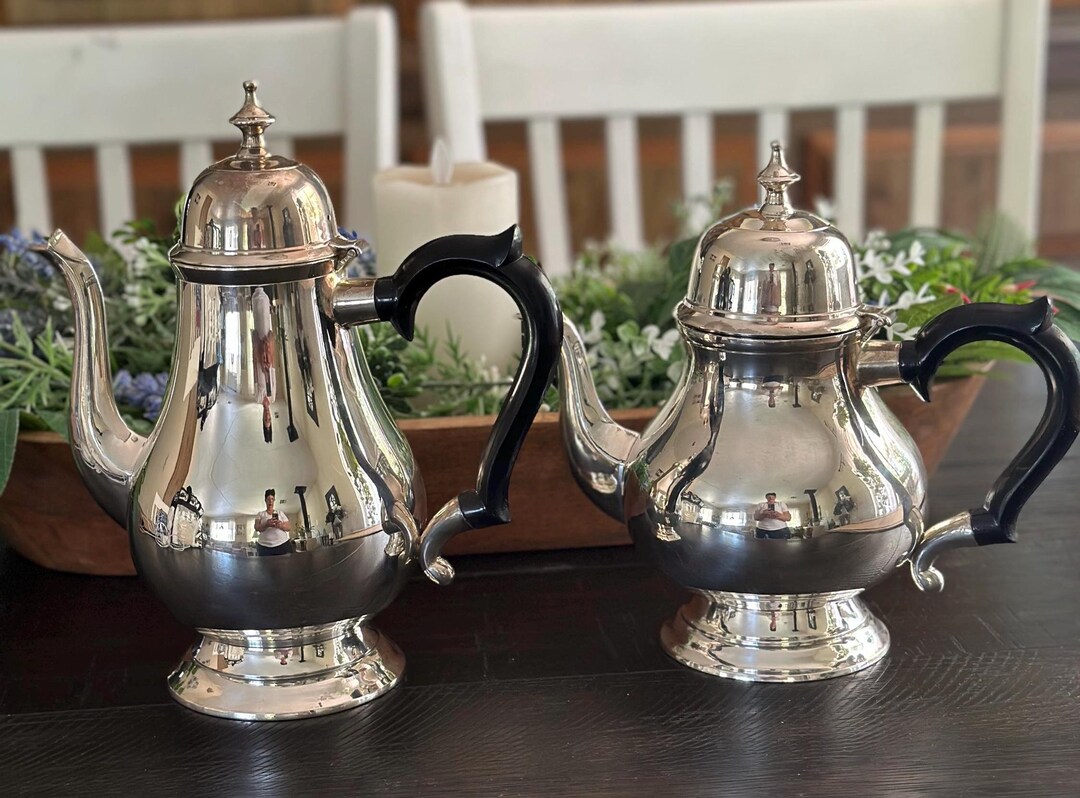 Two Silver Metal Teapots, of Indian Origin. These Teapots Have a ...