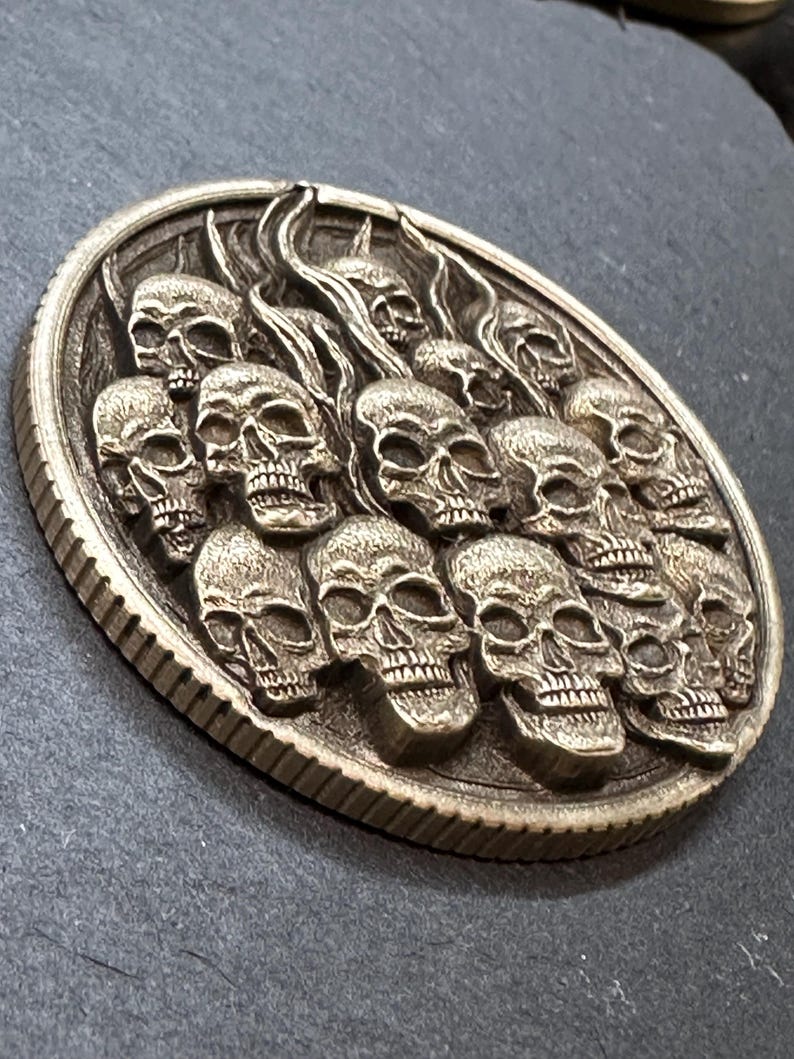 3D Laser Engraved Brass Coin. Extra Deep Engraving of a Pile of Skulls ...