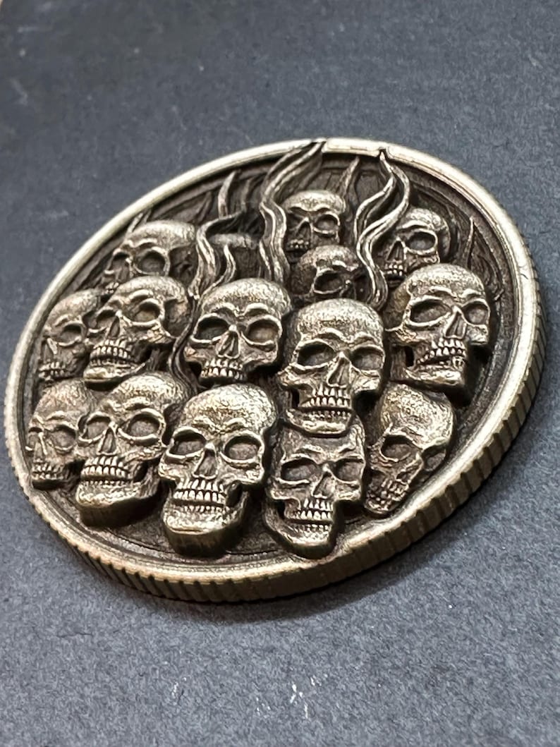 3D Laser Engraved Brass Coin. Extra Deep Engraving of a Pile of Skulls ...