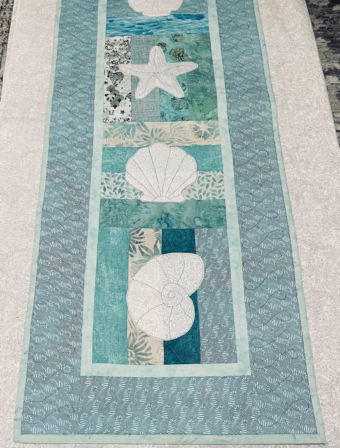 Seashells in Ocean Art Quilt Wall Hanging. Quilting Resembles Movement ...