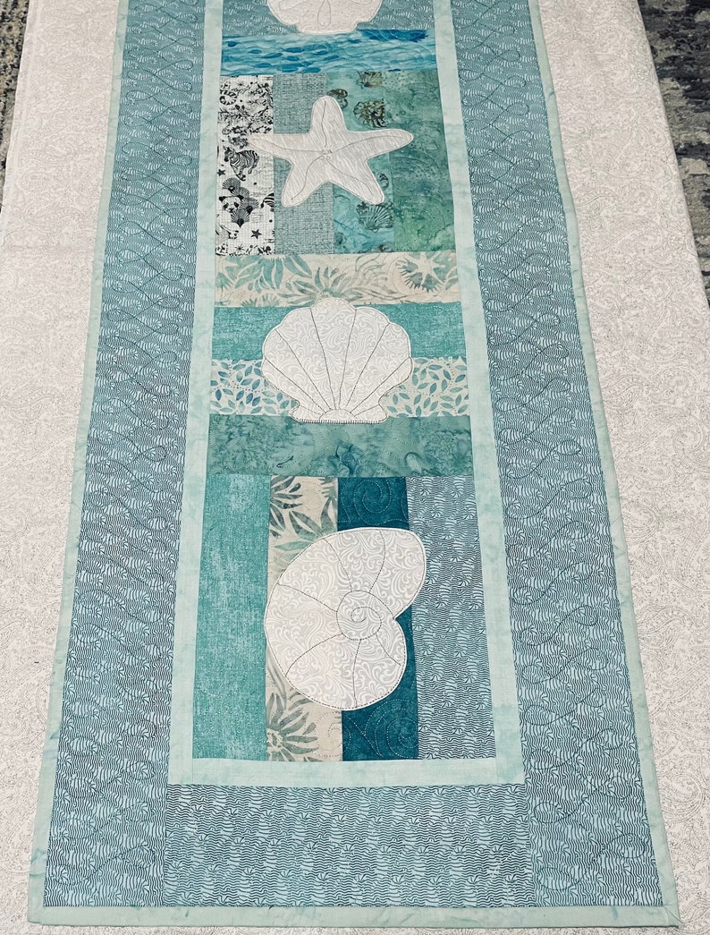 Seashells in Ocean Art Quilt Wall Hanging. Quilting Resembles Movement ...
