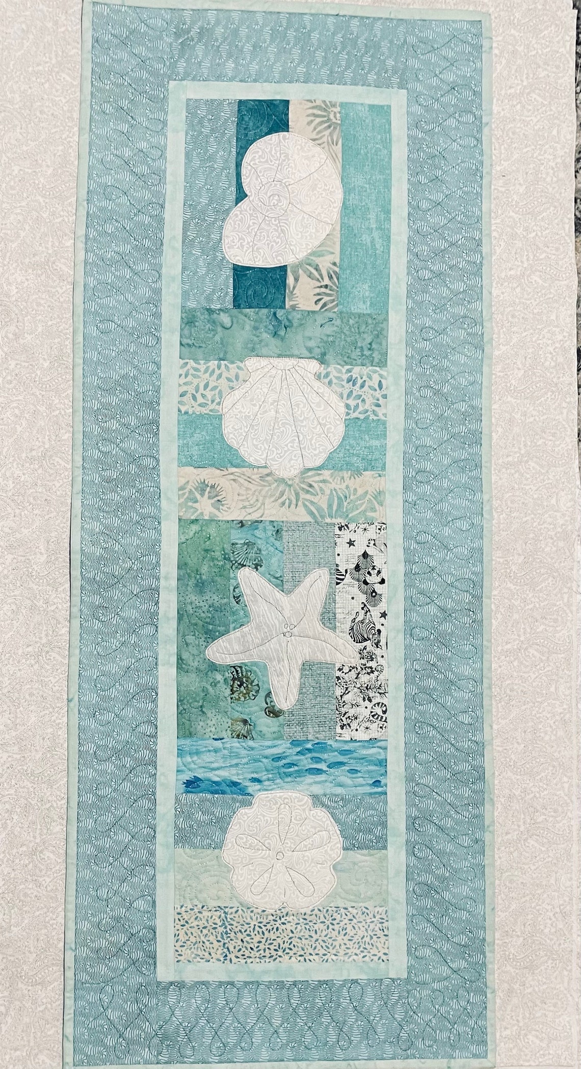 Seashells in Ocean Art Quilt Wall Hanging. Quilting Resembles Movement ...