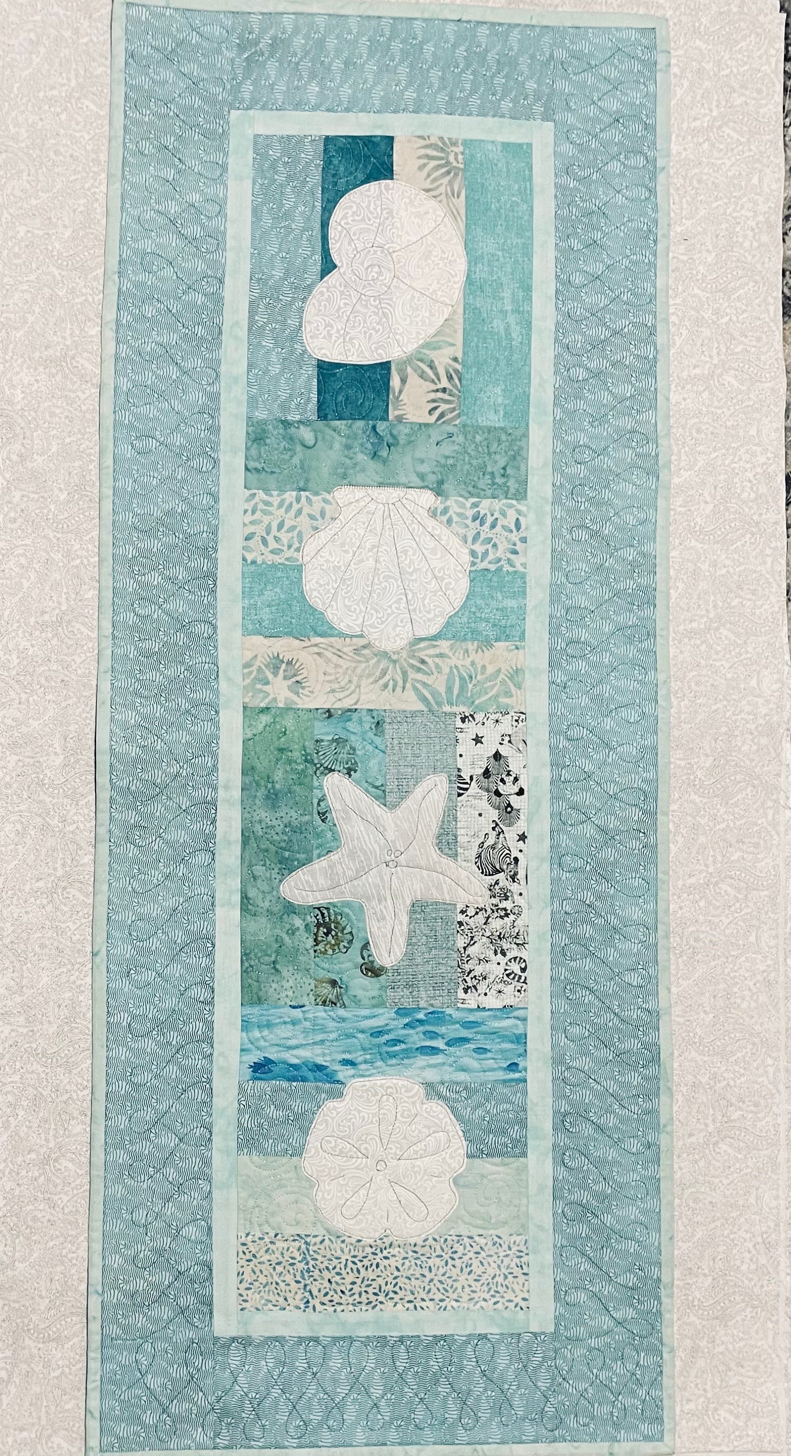 Seashells in Ocean Art Quilt Wall Hanging. Quilting Resembles Movement ...