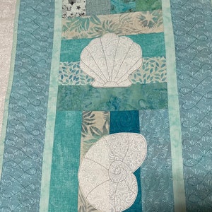 Seashells in Ocean Art Quilt Wall Hanging. Quilting Resembles Movement ...