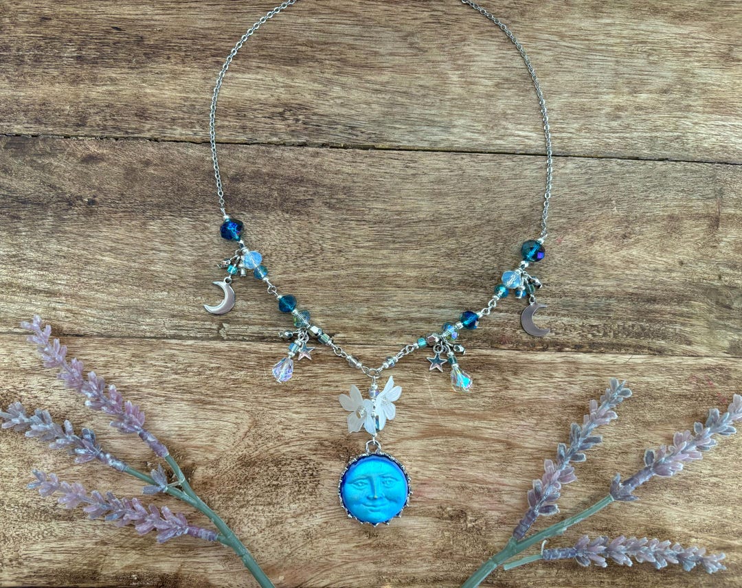 Iridescent Blue Moon Face Pendant Beaded Chandelier Necklace | Kirks ...