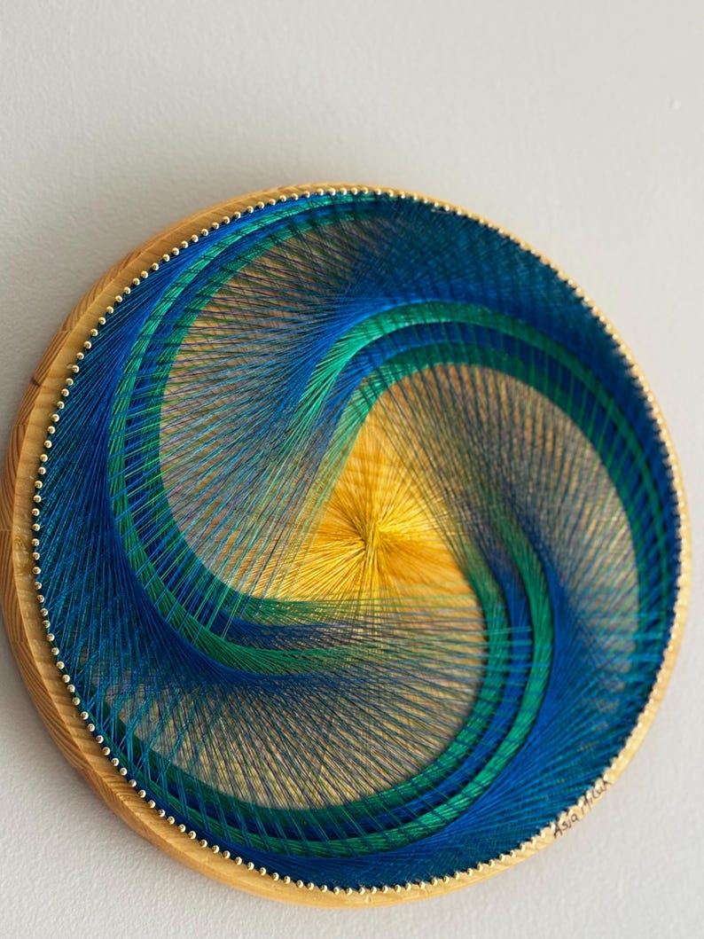 Geometric Spiral String Art: Blue, Green, and Yellow Fiber Wall Hanging ...