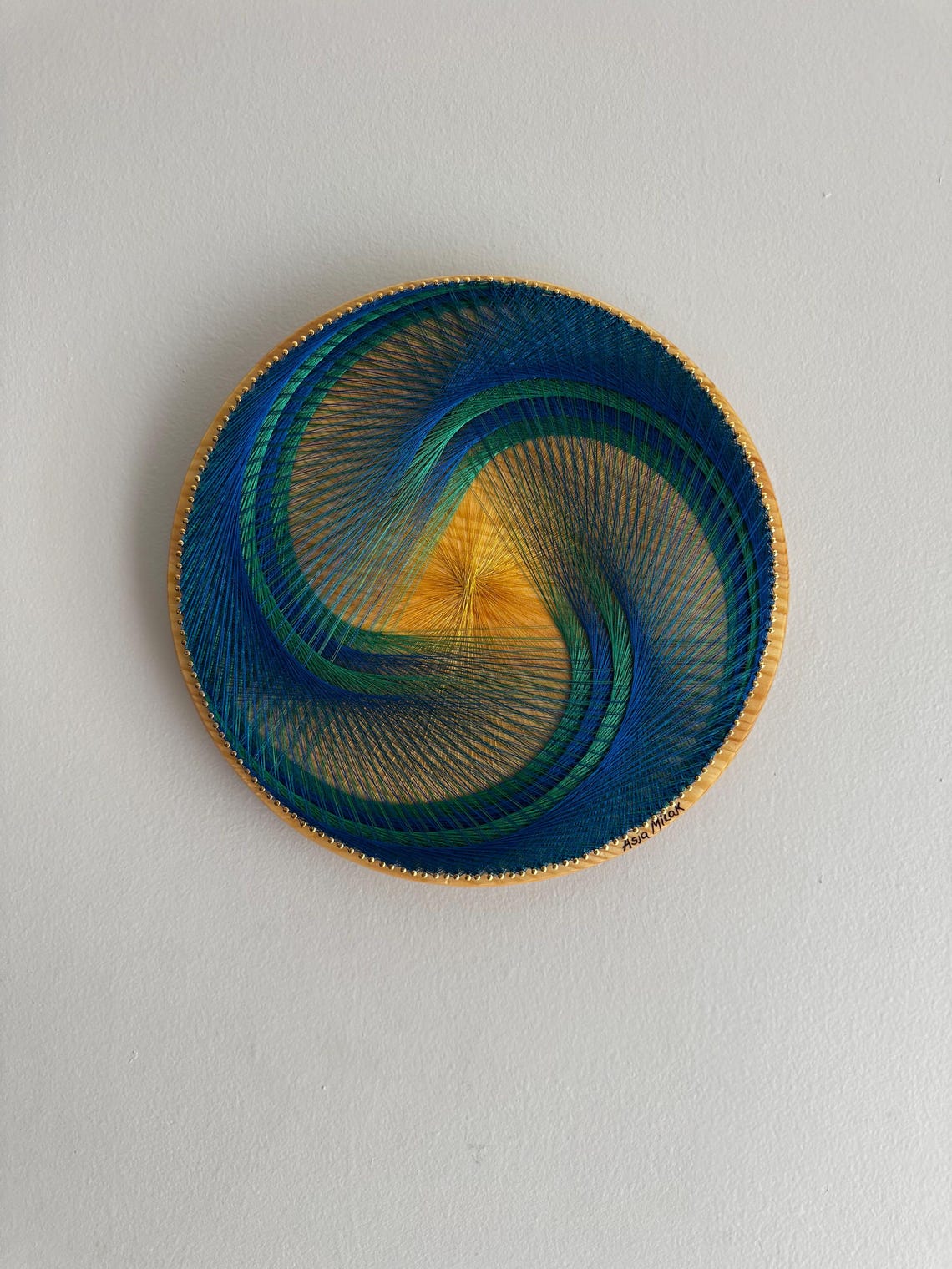 Geometric Spiral String Art: Blue, Green, and Yellow Fiber Wall Hanging ...