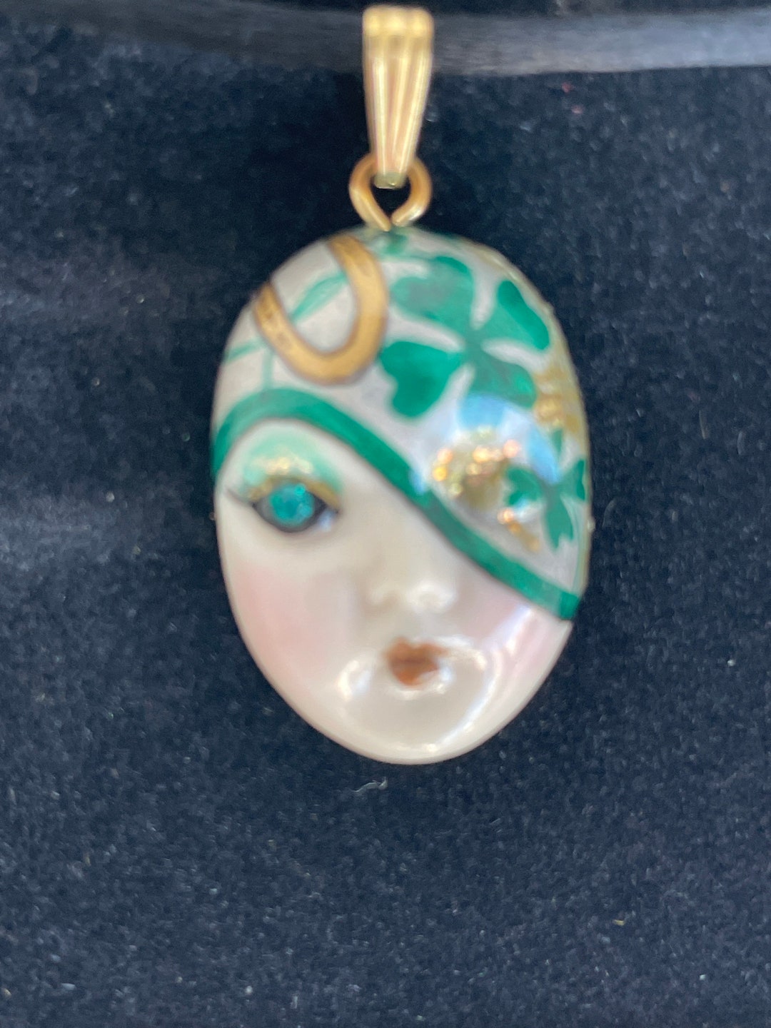 Lady Luck Adagio Face Pendant Wears a Cloche of Emerald Green Four-leaf ...