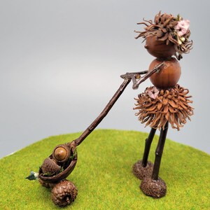 Oakie Acorn Mother, Out for a Walk With Her Baby in a Baby Stroller ...