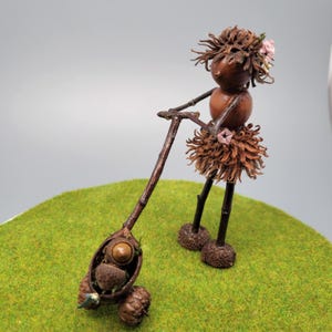 Oakie Acorn Mother, Out for a Walk With Her Baby in a Baby Stroller ...