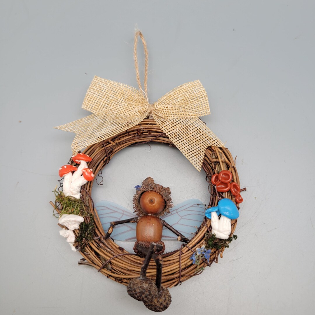 Oakie Acorn Elf Fairy Sitting on a Wreath Surrounded by Moss and ...