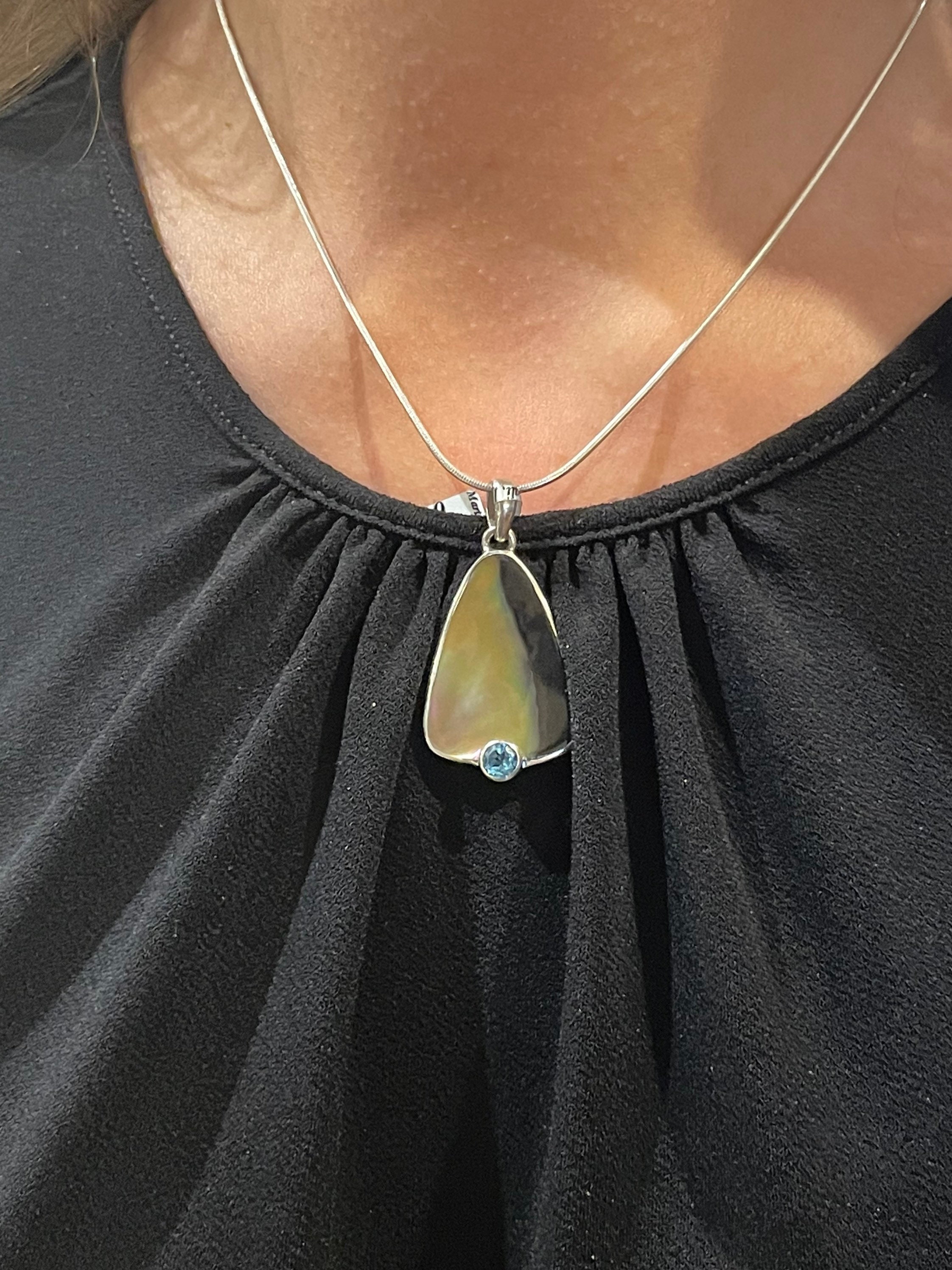 Marta Howell Blue Topaz and Pteria Penguin Shell Pendant - Etsy