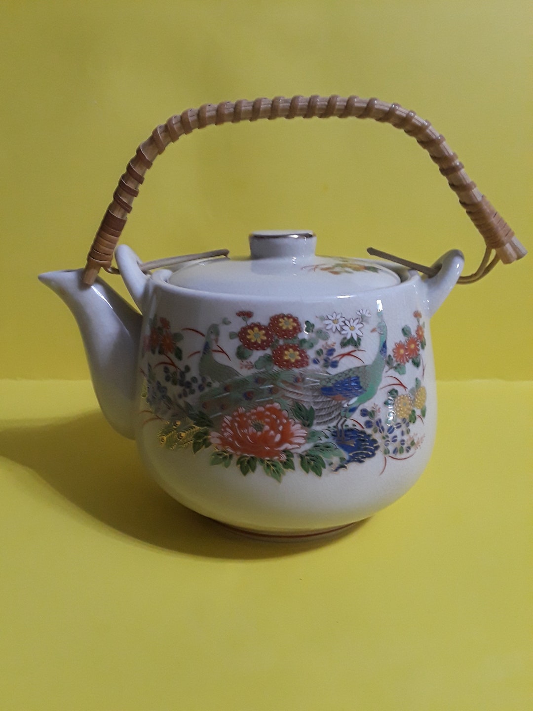 Ceramic Teapot Featuring a Peacock Design With Gold Accents and a ...