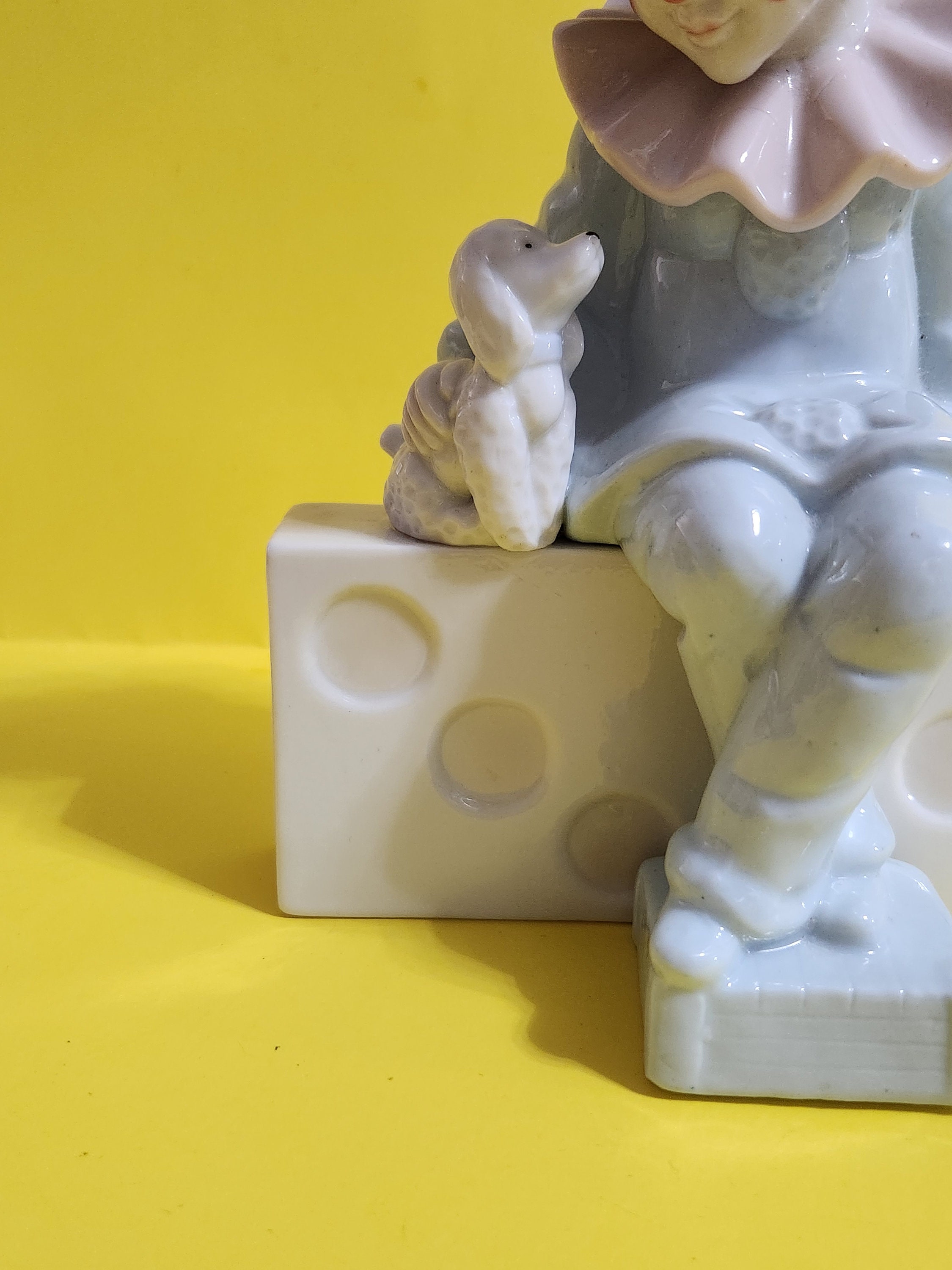 Porcelain Pastel Colored Clown Figurine Featuring a Clown Sitting on a ...