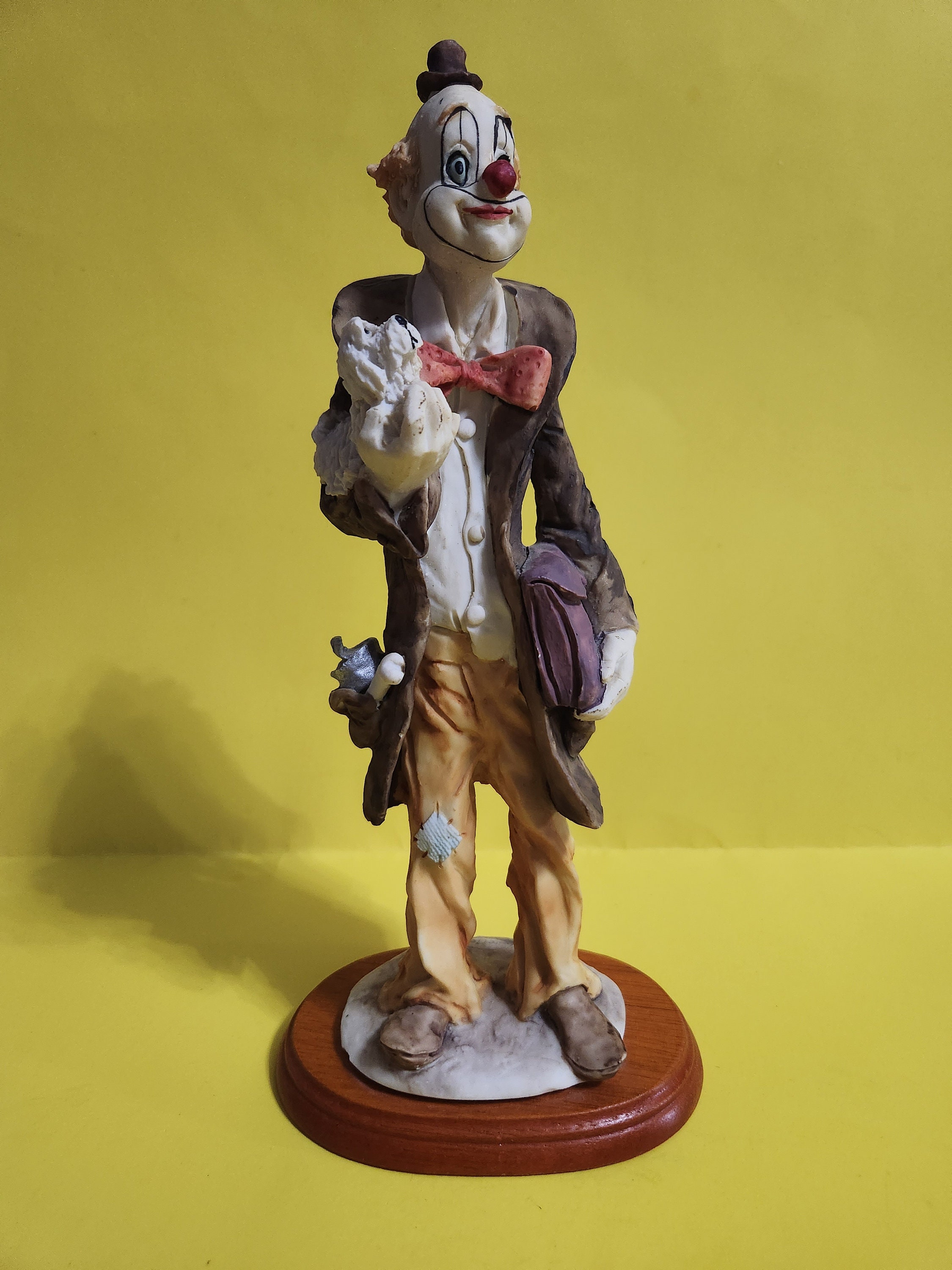 Tall Clown Figurine on Wooden Base Featuring a Clown Holding a Puppy ...